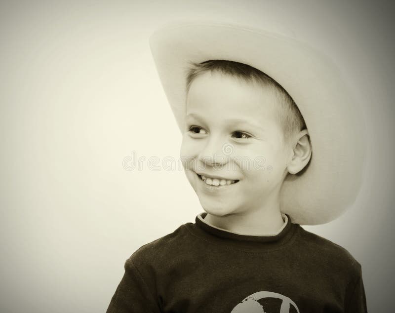 Cute boy in cowboy s hat stock photo. Image of face, human - 49626402