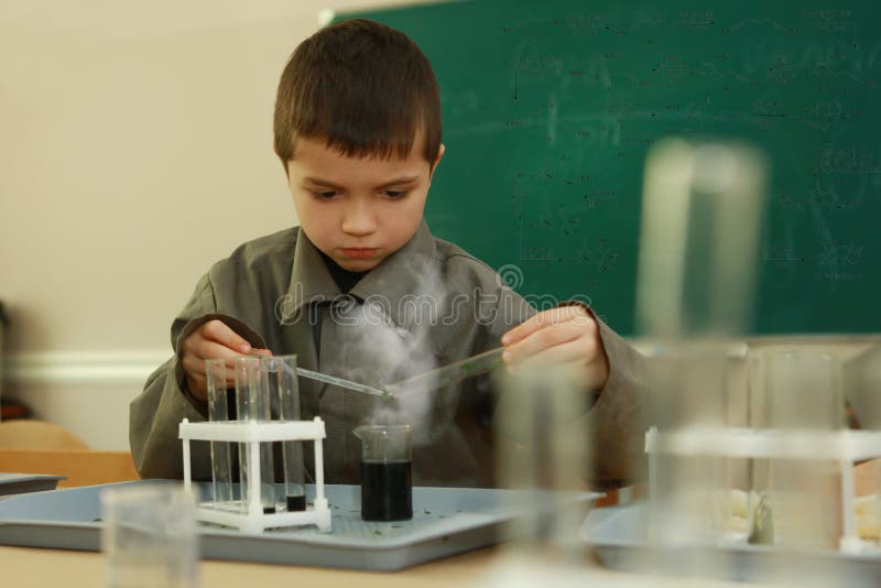 Cute Boy Doing Experiments at a Chemistry Master Class. Stock Photo ...