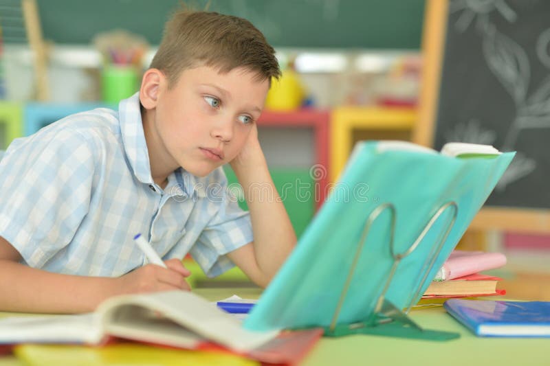 Portrait of Boy Doing Homework at Desk Stock Image - Image of smiling ...
