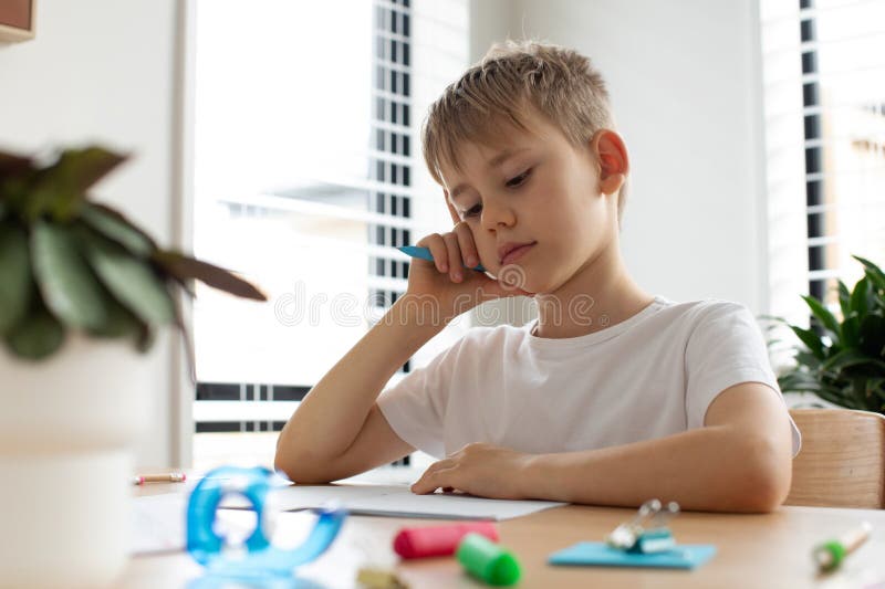 Brother and Sister Write and Draw Together with Pencils at the Table ...