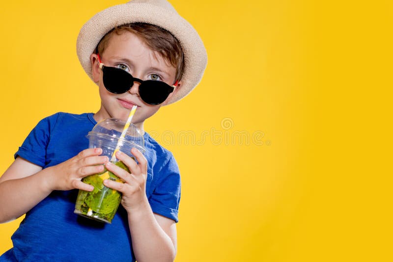 Cute Boy Drink Mojito Cocktail from Plastic Cup Over Yellow Studio ...