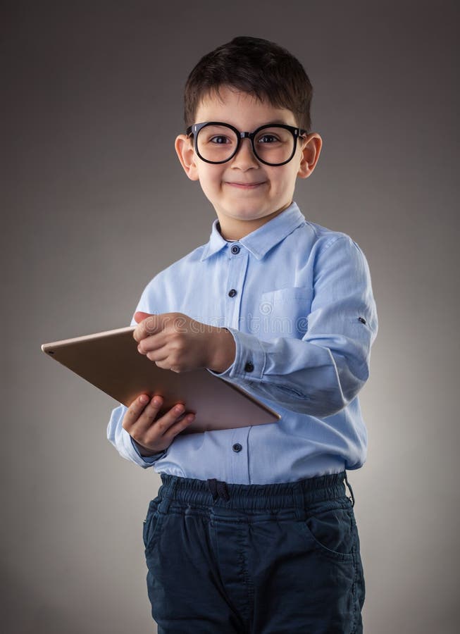 Cute Boy with Electronic Tablet on the Gray Background Stock Image ...