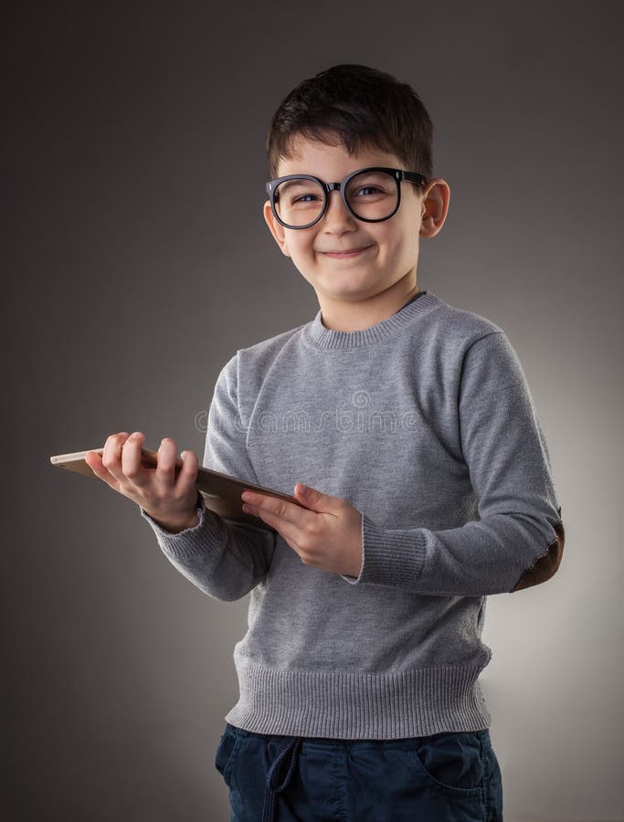 Cute Boy with Electronic Tablet on the Gray Background Stock Image ...