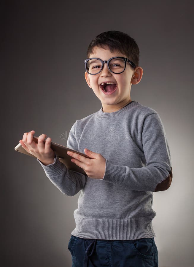 Cute Boy with Electronic Tablet on the Gray Background Stock Image ...