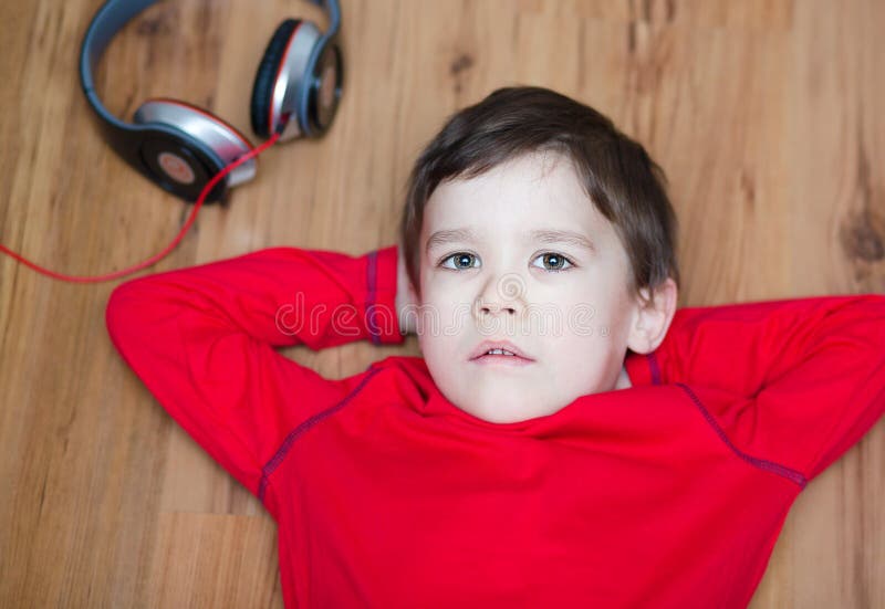 Cute Boy Enjoying Music Using Headphones Stock Photo - Image of ...