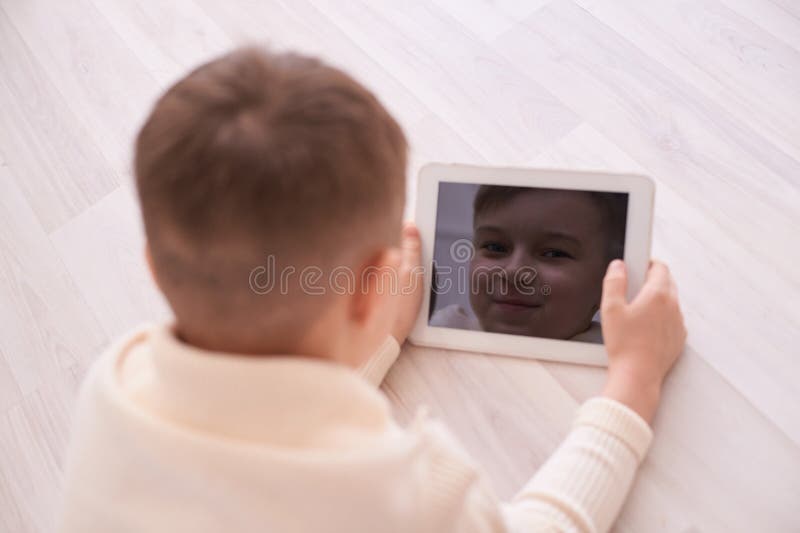 Cute Boy. Face on Screen. Light Background. Horizontal Stock Image ...