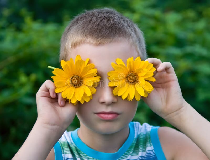 Cute Boy with Flowers on Eyes Having Fun Stock Photo - Image of ...