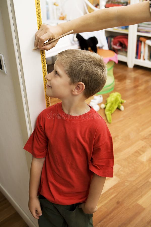 Cute Boy Getting Height Measurement Stock Photos - Free & Royalty-Free ...