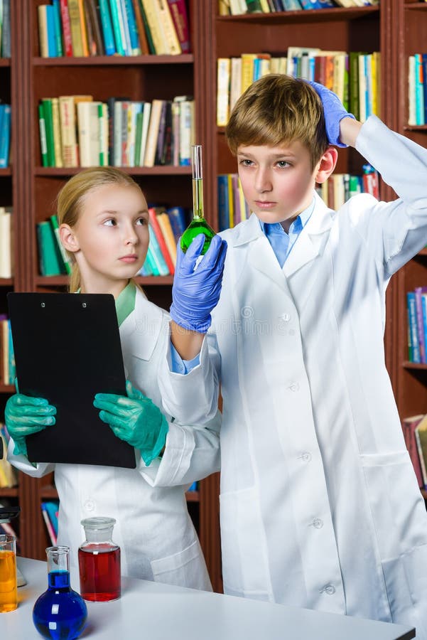 Cute Boy and Girl Doing Biochemistry Research in Stock Image - Image of ...