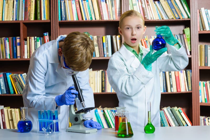 Cute Boy and Girl Doing Biochemistry Research in Stock Image - Image of ...