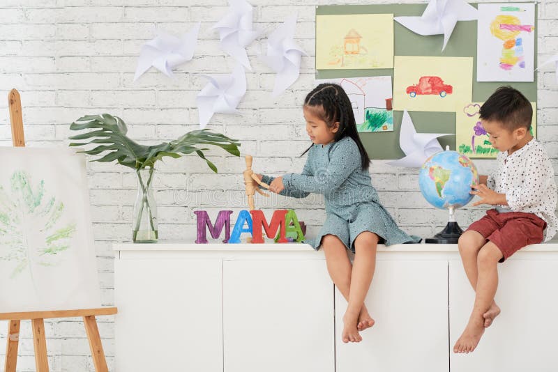 Boy and Girl Playing in Art Class Stock Photo - Image of classroom ...