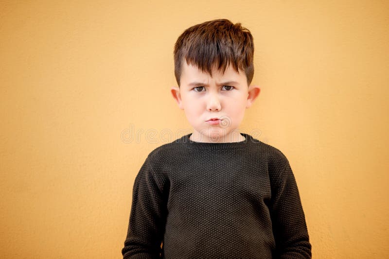 Cute boy with a grumpy stock image. Image of furious - 106954873