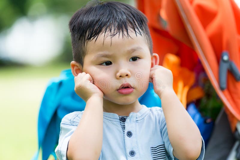 Cute boy with hand on ear stock image. Image of cute - 59730447