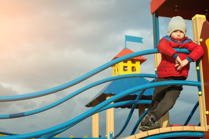 Cute Boy Having Fun on Outdoor Playground in Cold Weather. Stock Image ...