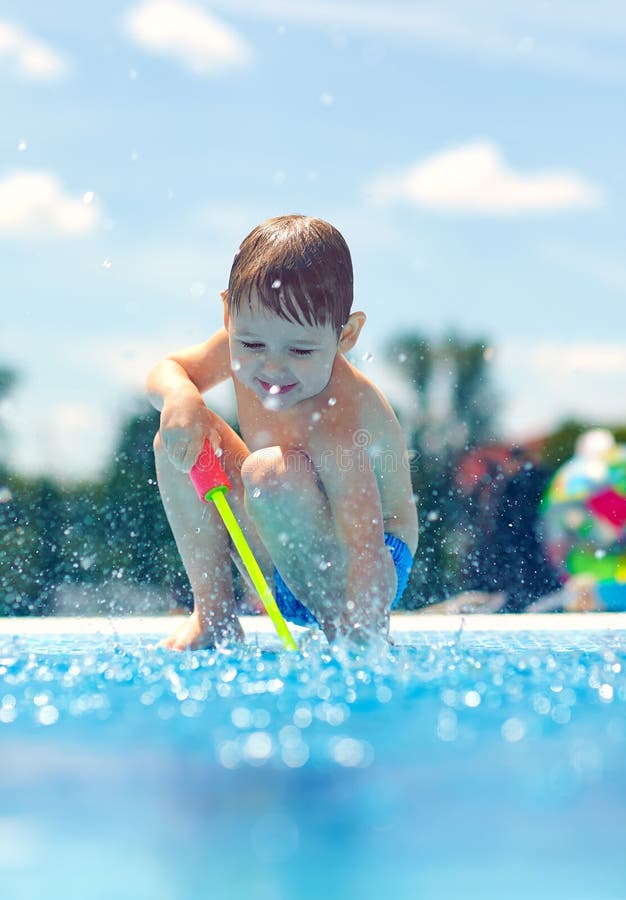 Cute Boy Having Fun, Playing Near the Pool Stock Image - Image of ...