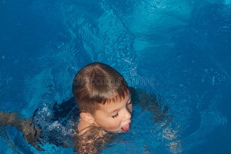 Cute Boy Taking Sun Near a Swimming Pool Stock Photo - Image of holiday ...