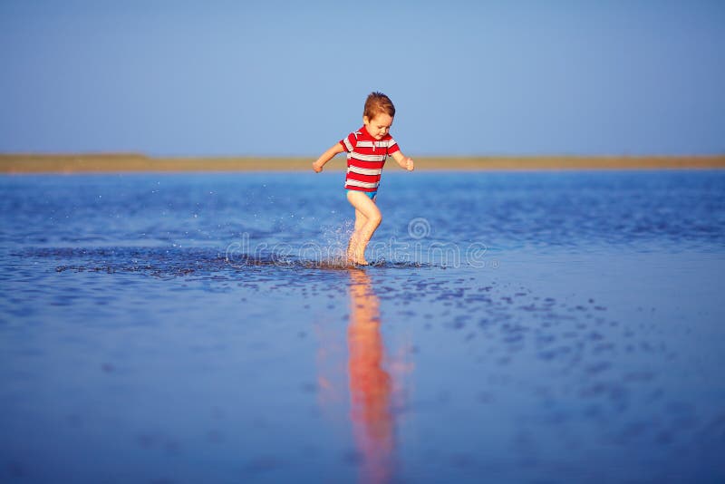 Cute Boy Kid Running the Lake Stock Image - Image of lifestyle, play ...