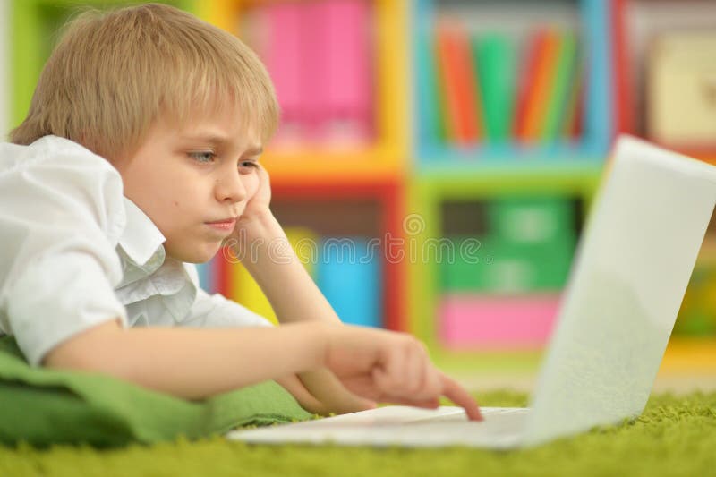 Cute boy with a laptop stock photo. Image of happy, smiling - 95687950