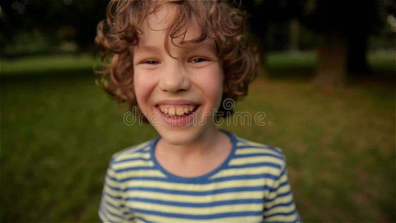 Cute Boy Laughing in the Park, Close-up, Slow Motion Stock Video ...