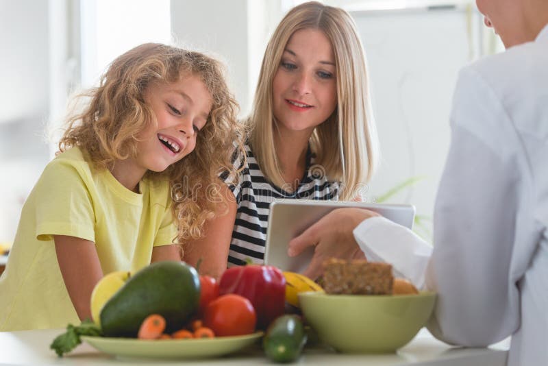 Boy Learning the Secrets of Healthy Nutrition during Classes with a ...