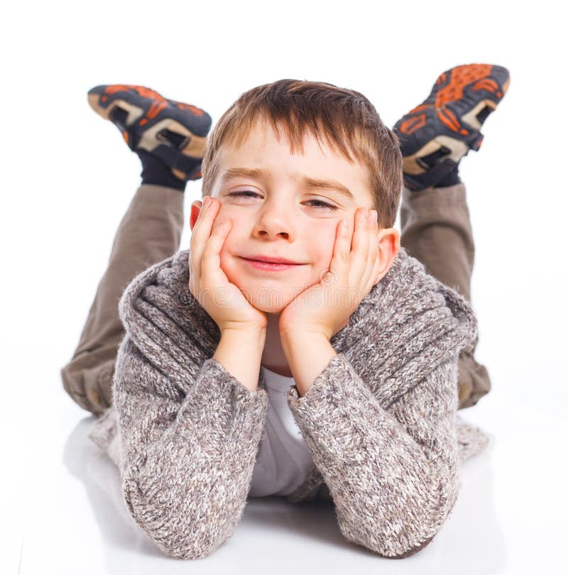 Cute boy lying on floor stock image. Image of happiness - 24856839