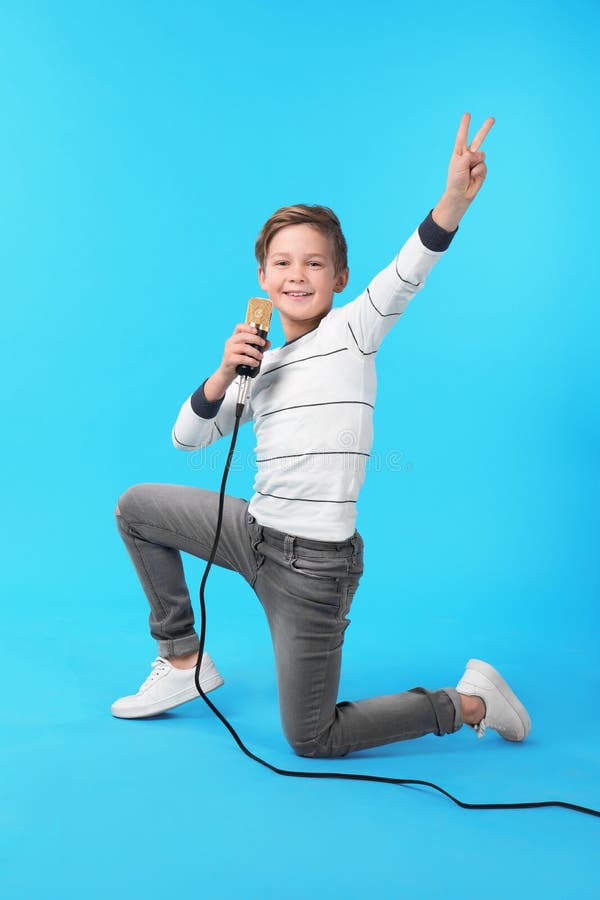 Cute Boy with Microphone on Background Stock Photo - Image of child ...