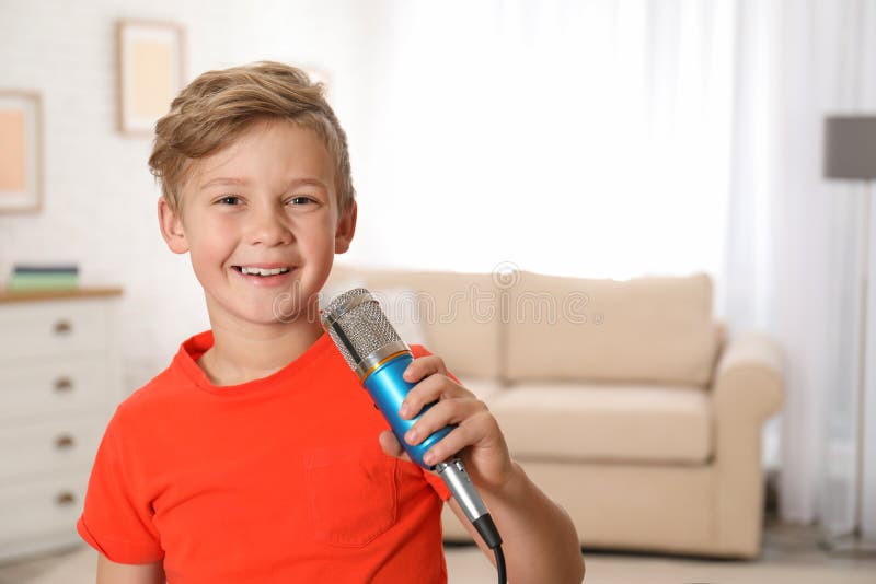 Cute Boy with Microphone in Room Stock Image - Image of home, happy ...