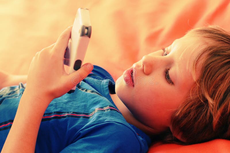Cute boy with mobile phone stock image. Image of child - 47955369