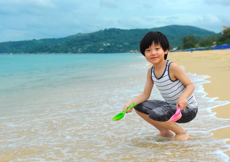 Cute Boy Playing on the Beach Stock Image - Image of little, asia: 22637433