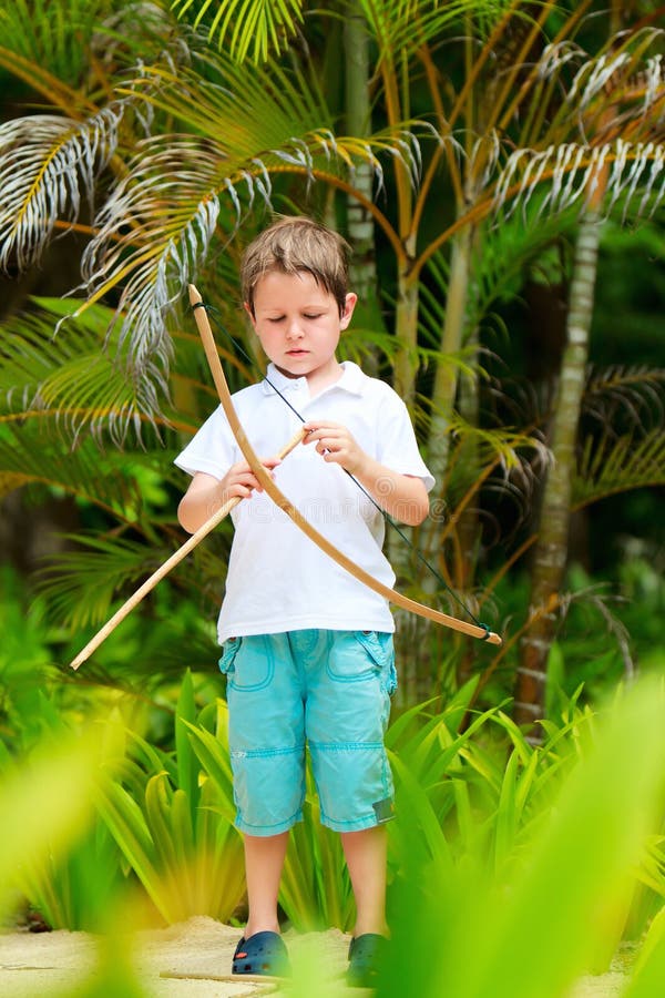 Cute Boy Playing with Bow and Arrows Stock Image - Image of arrow ...