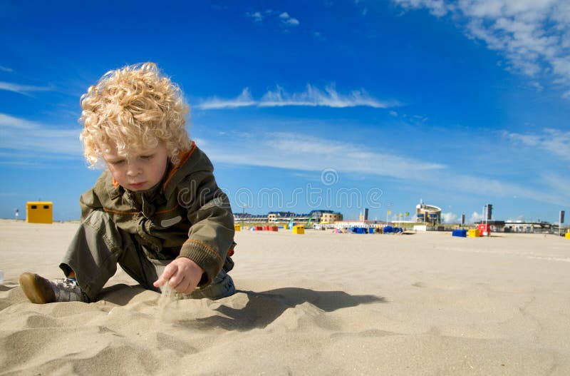 Cute boy playing with sand stock photo. Image of healthy - 5830380