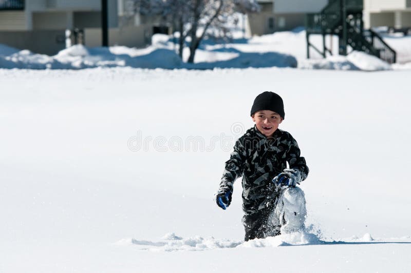Cute Little Boy Riding Motorcyle in the Snow Outdoors. Stock Image ...