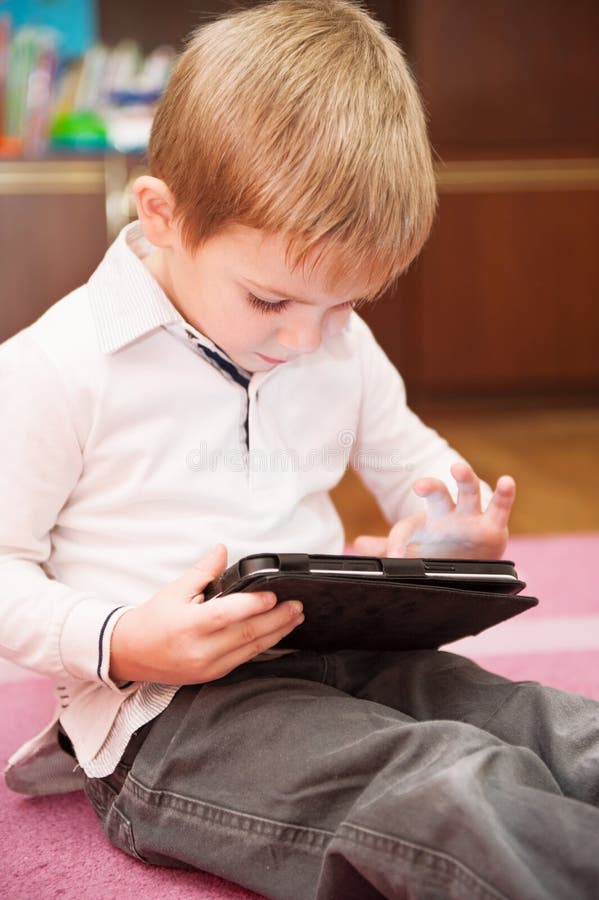 Happy Asian Boy Playing IPad Stock Image - Image of ipad, happy: 20405233