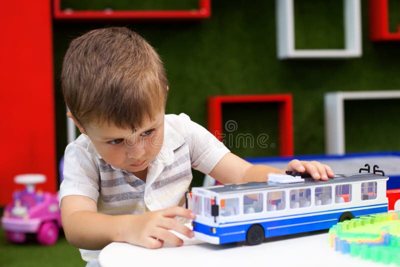 Cute Boy Playing with Trolley Car. Developing Toys. Stock Photo - Image ...