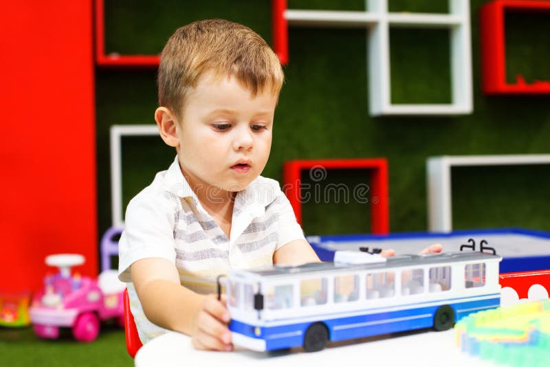 Cute Boy Playing with Trolley Car. Developing Toys Stock Photo - Image ...