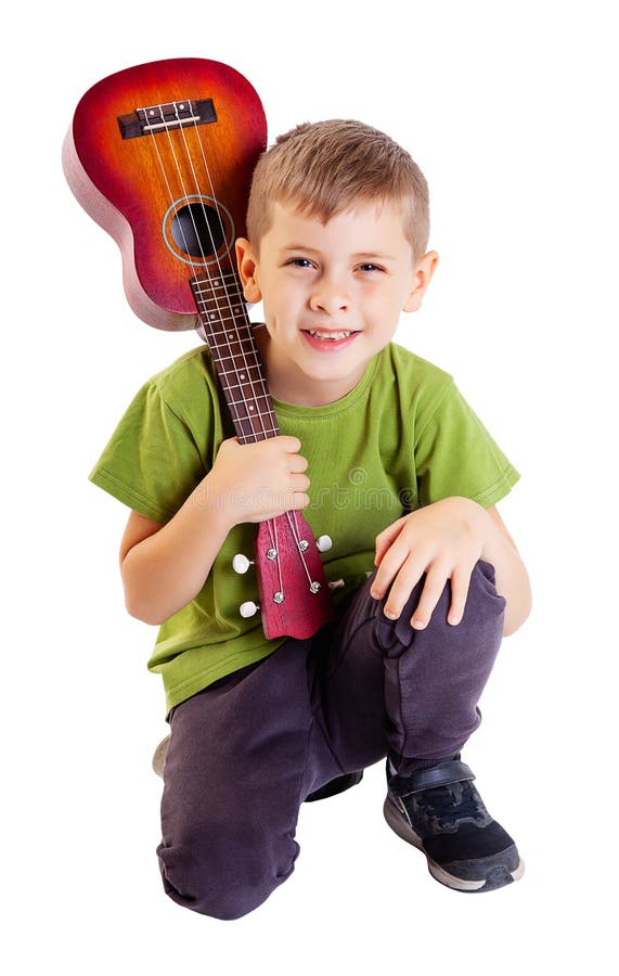 Cute Boy Playing the Ukulele Guitar Stock Photo - Image of childhood ...