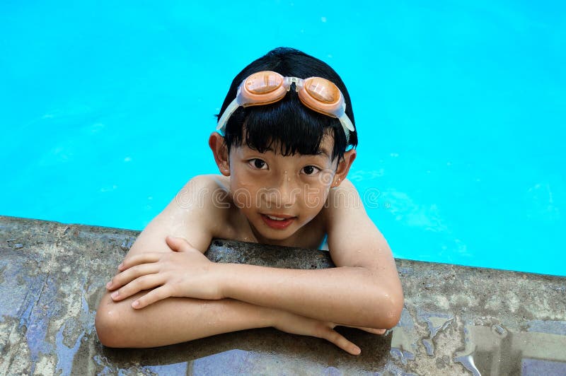 Cute Boy at the Poolside stock photo. Image of smiling - 42804504