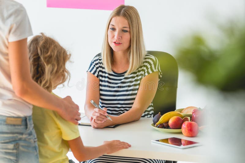 Boy and Professional Dietitian Preparing a Diet Eating Plan Stock Image ...