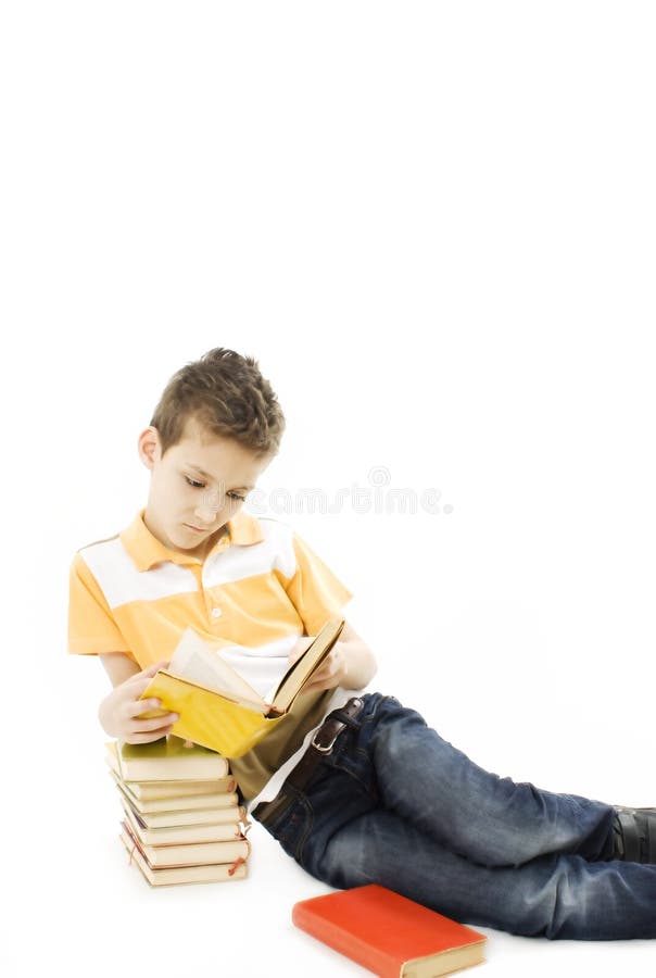 Cute Boy Reading a Book on the Floor Stock Photo - Image of head ...