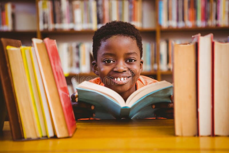 Cute Boy Reading Book in Library Stock Image - Image of portrait, happy ...