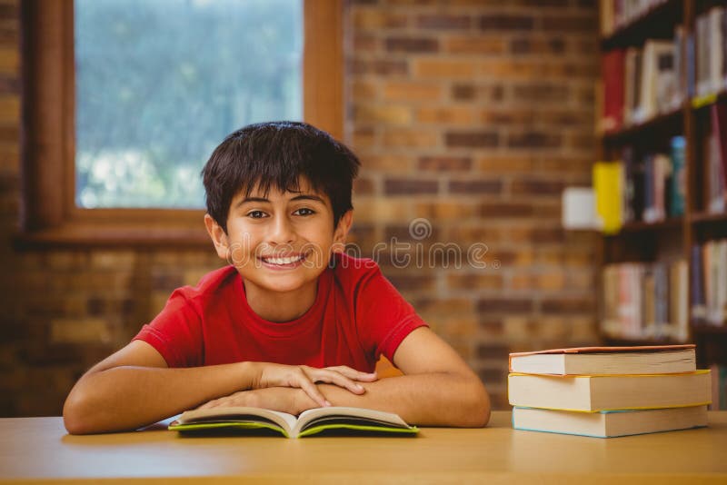 Cute Boy Reading Book in Library Stock Photo - Image of education, head ...