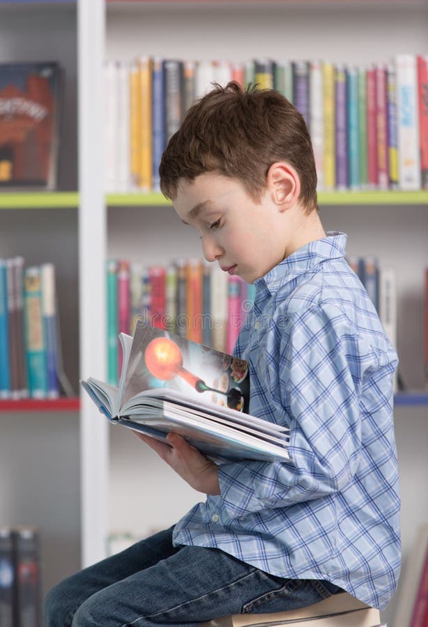 Cute Boy Reading Book in Library Stock Image - Image of learn ...