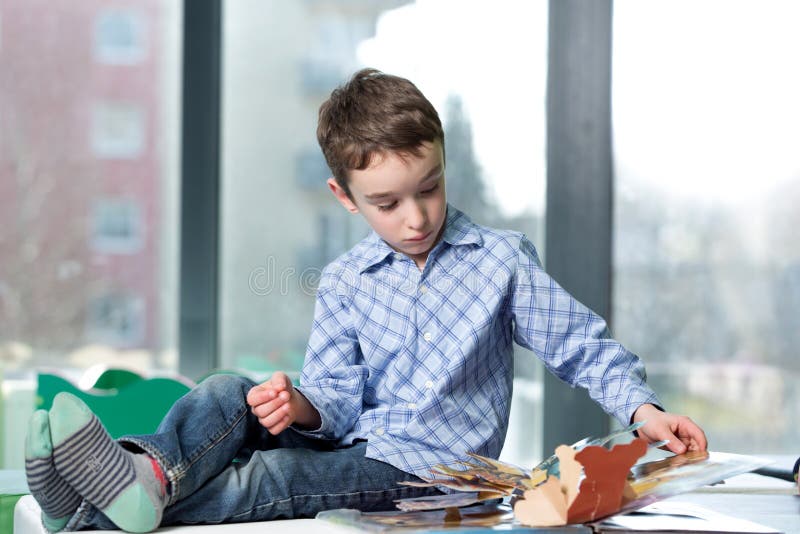 Cute Boy Reading Book in Library Stock Image - Image of academic, kids ...