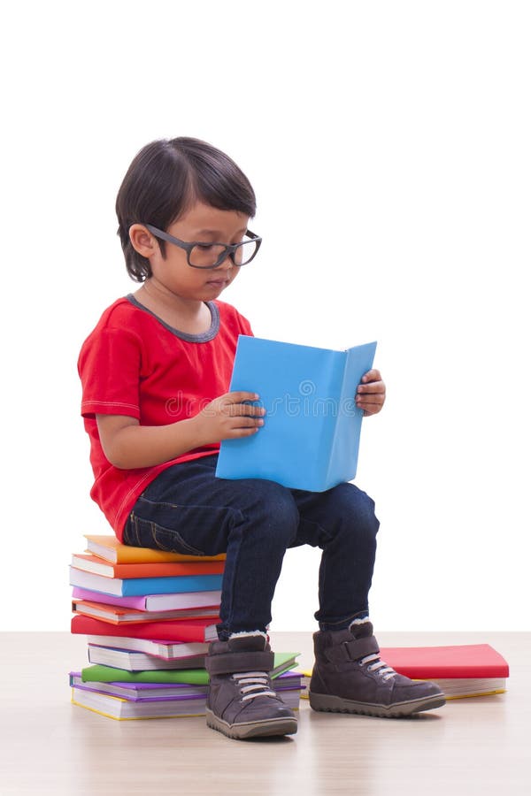 Cute boy reading a book stock photo. Image of asian, creative - 41463764