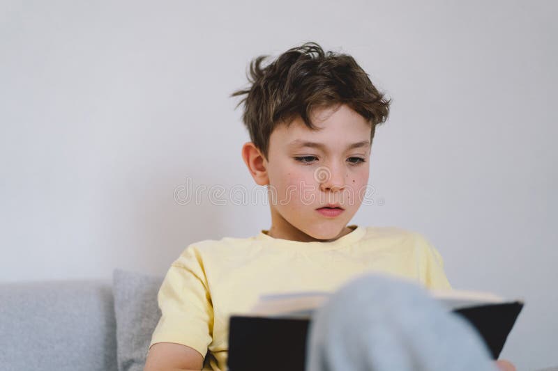Boy Reading an Interesting Book Stock Photo - Image of modern ...