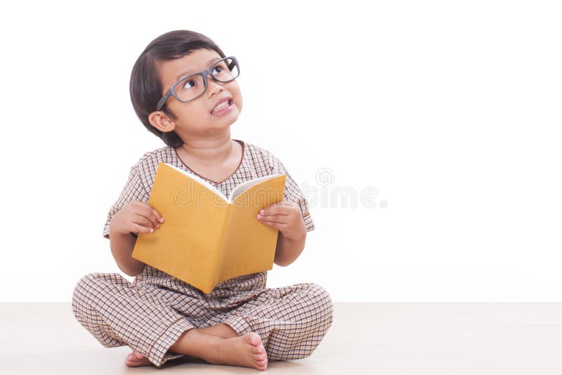 Cute boy is reading a book stock image. Image of closeup - 41465383