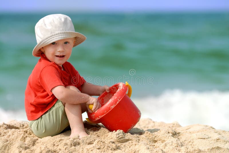 Little Boy Playing on the Beach Stock Photo - Image of outdoors ...