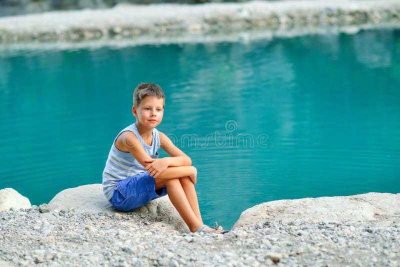 Cute boy on the river stock photo. Image of portrait - 62375346