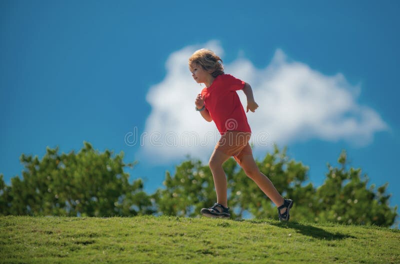 Cute Boy Running on Green Grass and Blue Sky. Kid Boy Playing and ...