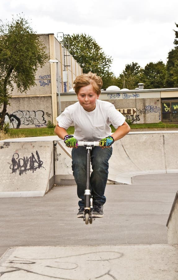 Boy is Scooting with His Scooter Stock Photo - Image of hobby, scooter ...